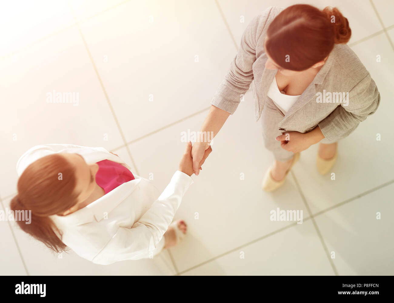 handshake of two business woman Stock Photo - Alamy