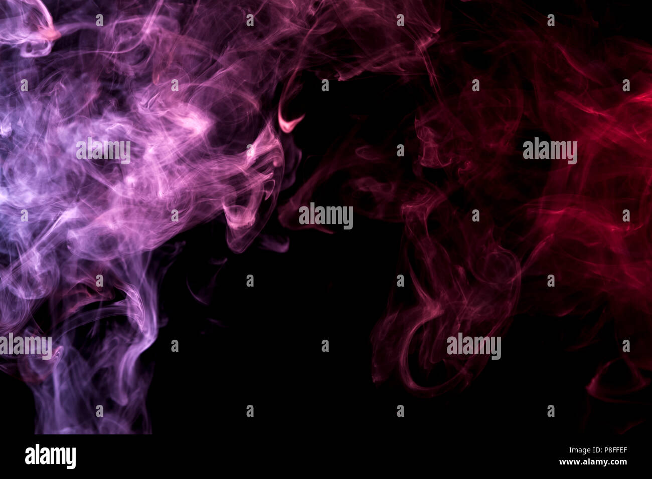 Pink, purple and red smoke on black background Stock Photo - Alamy
