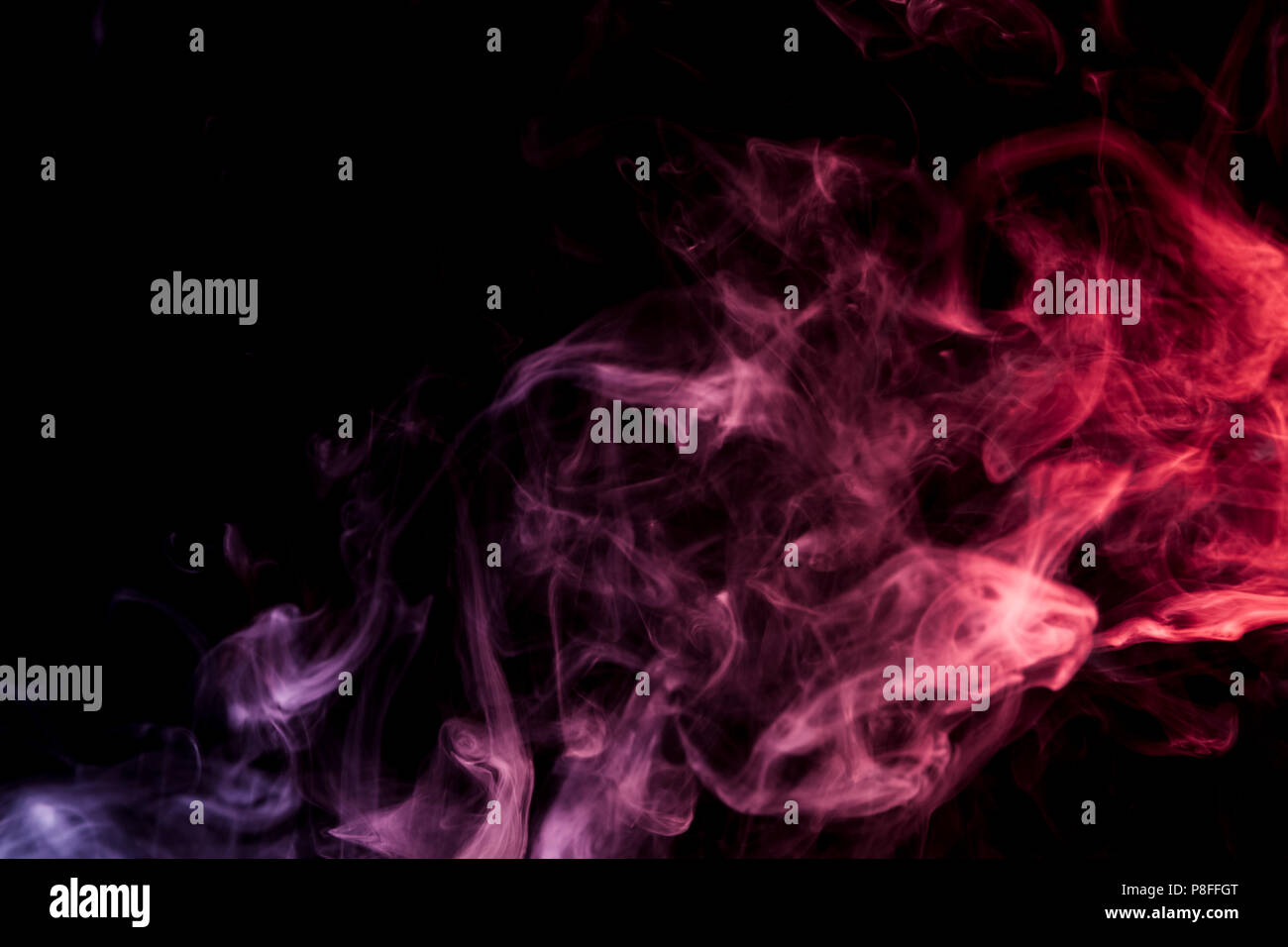 Red, purple and pink smoke on black background Stock Photo - Alamy