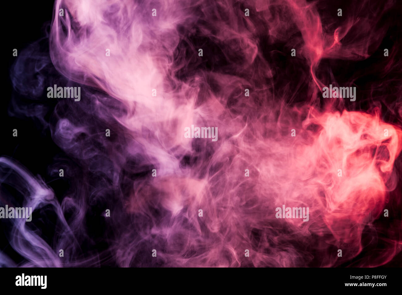 Red, purple and pink smoke on black background Stock Photo - Alamy