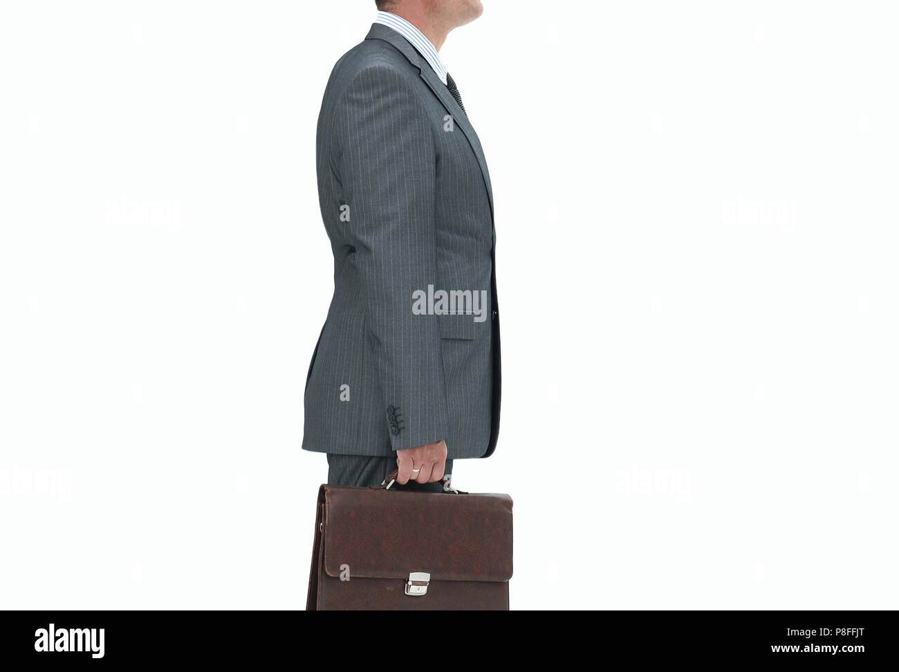side view.confident businessman with briefcase Stock Photo - Alamy