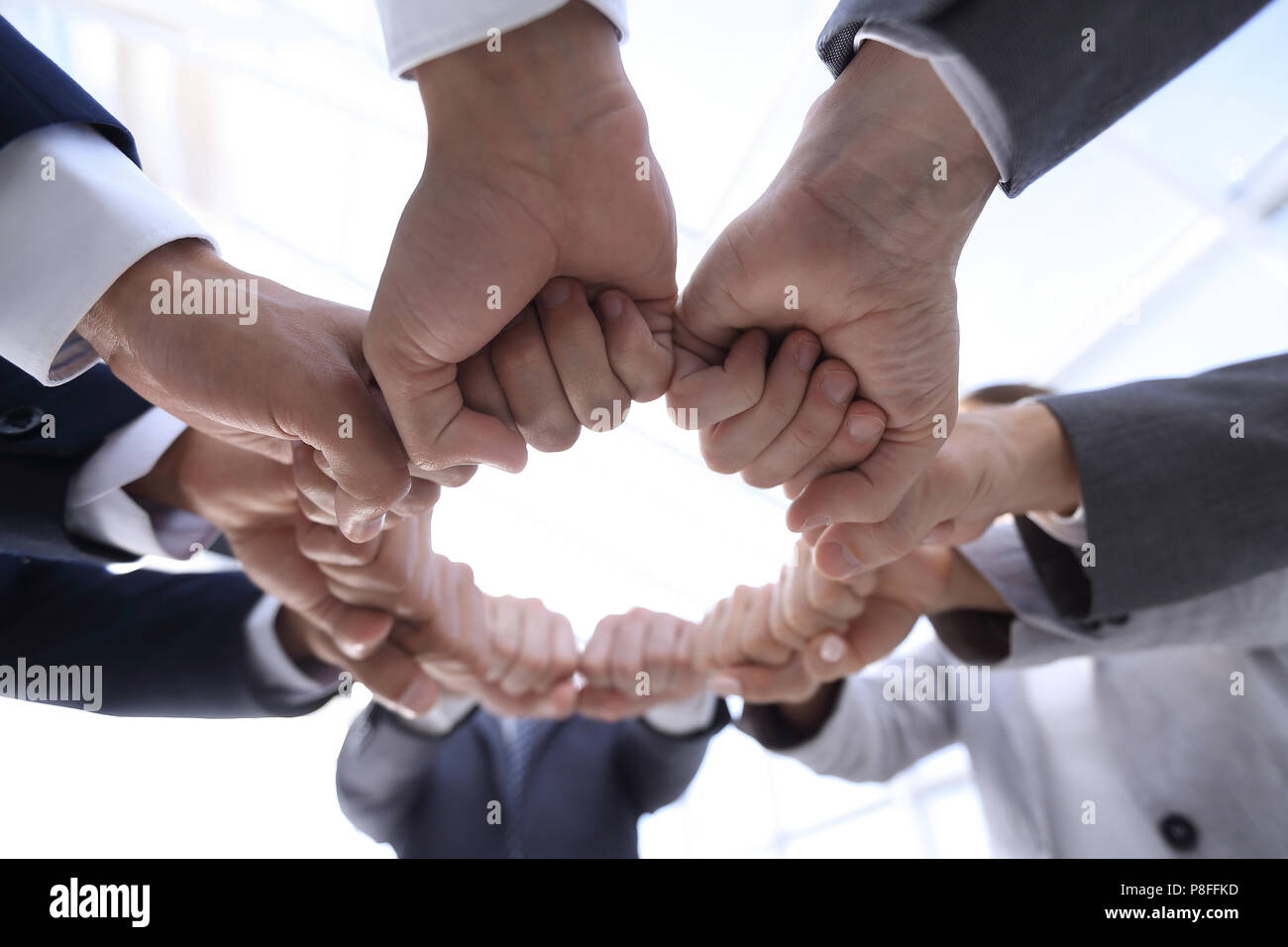 group of people joined their hands Stock Photo - Alamy