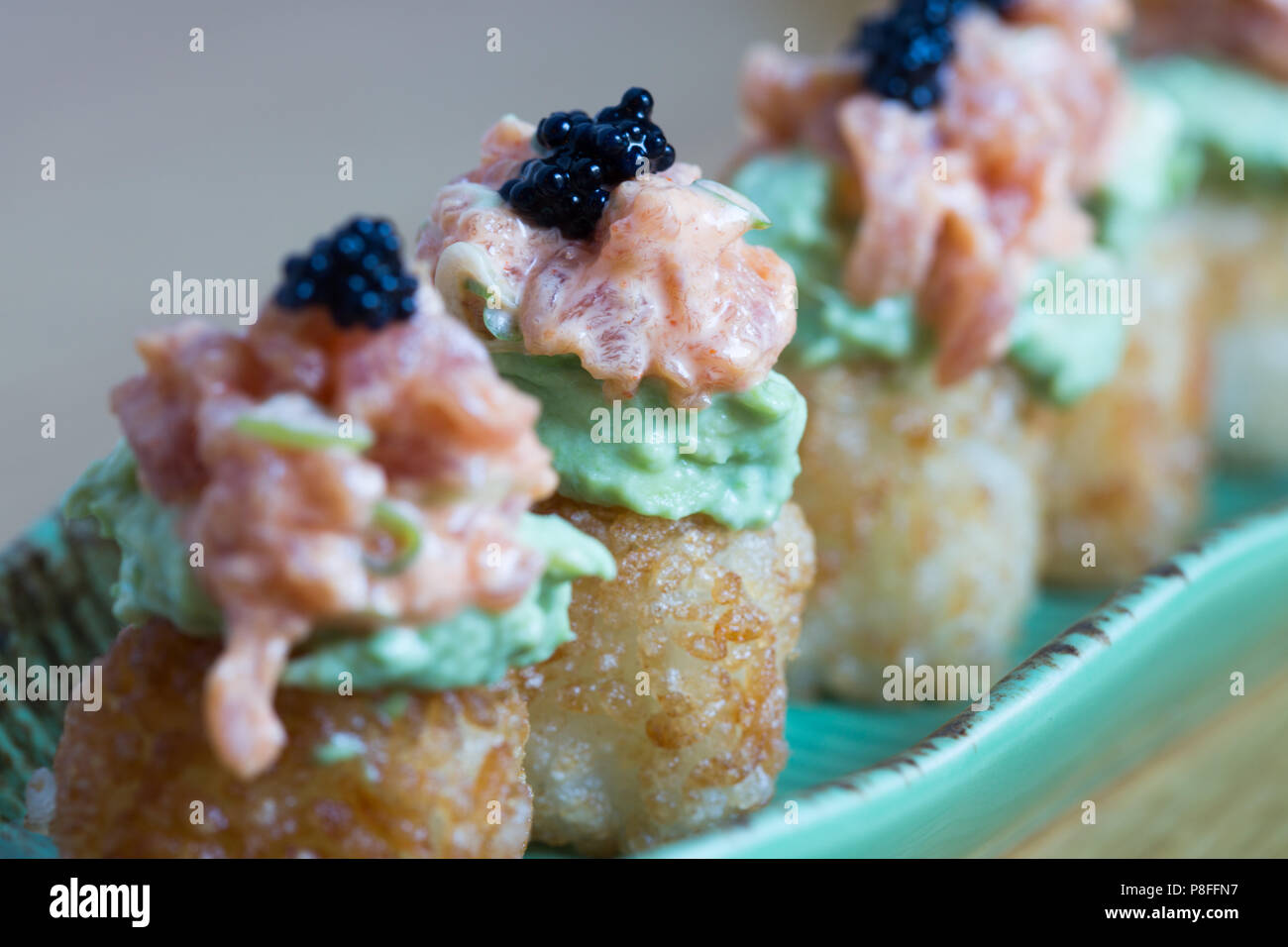 Individual sushi with fish roe Stock Photo - Alamy