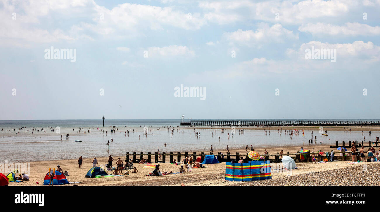 Visitors to the coast took advantage of the warm shallow water at ...