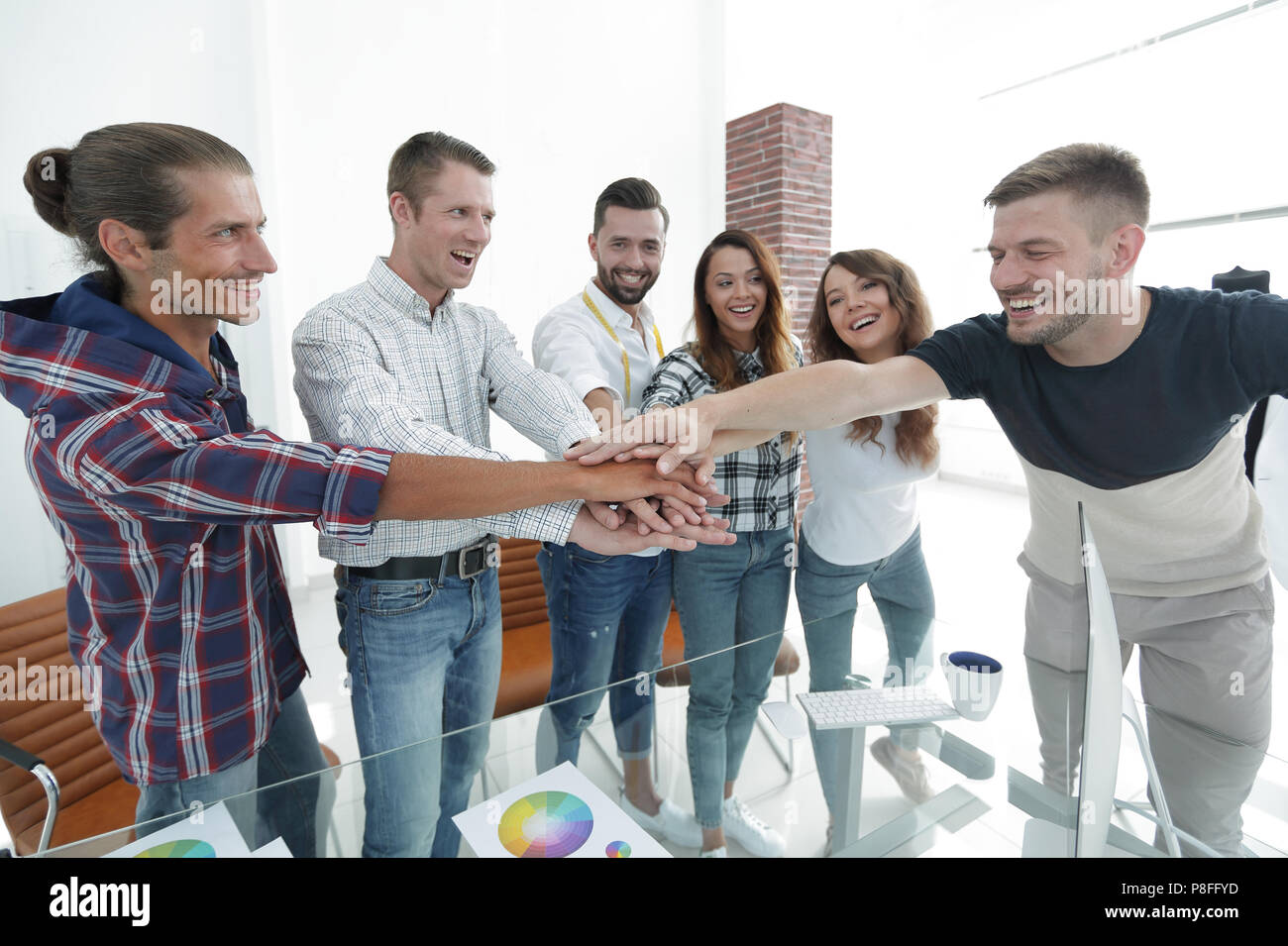 closeup .the design team shows their success Stock Photo - Alamy