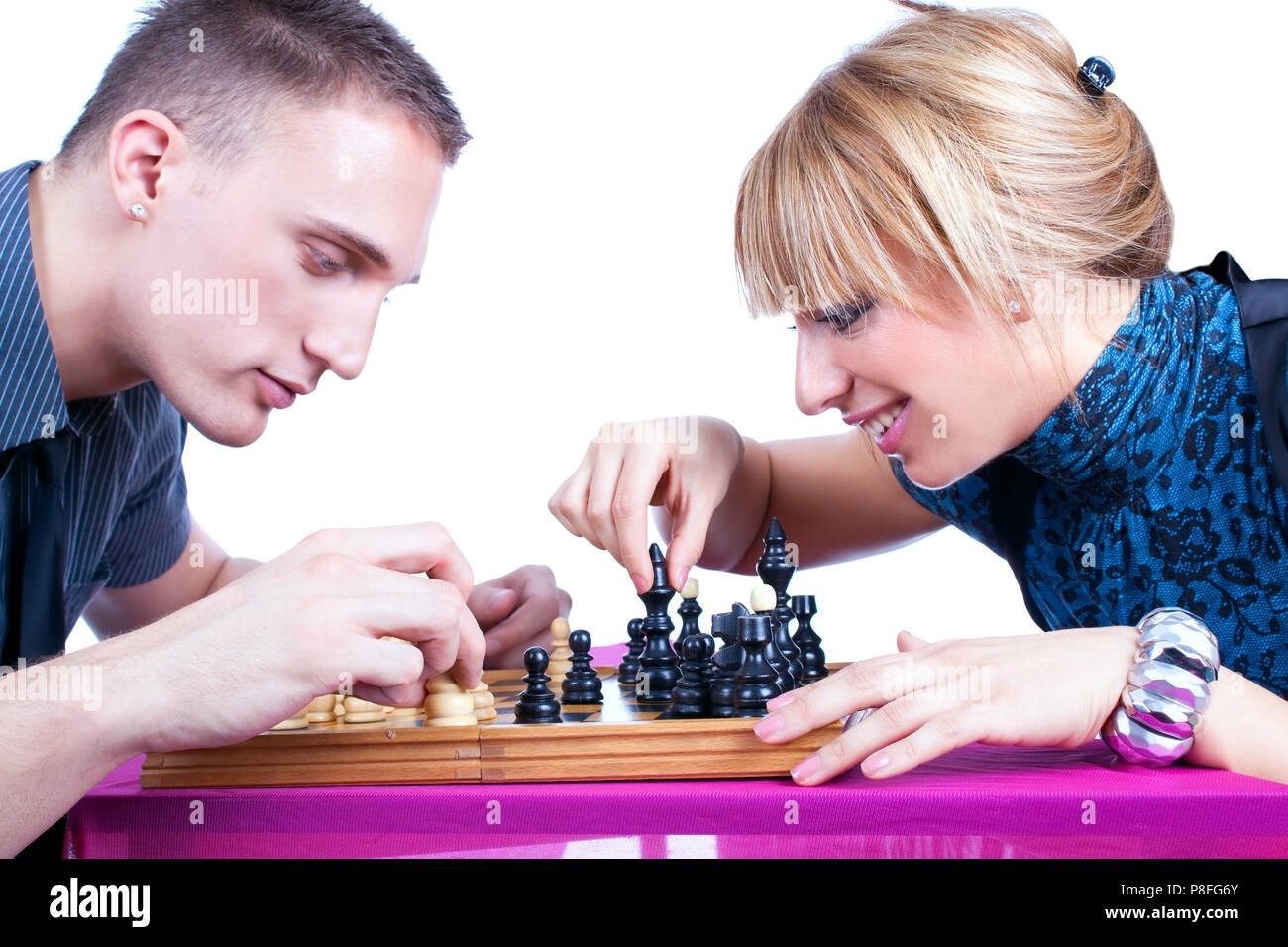 Relaxed young couple playing chess at home, isolated on white Stock ...
