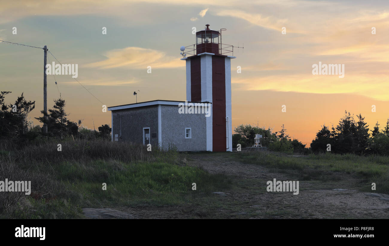 The Point Prim Lighthouse near Digby, Nova Scotia at sunset Stock Photo ...
