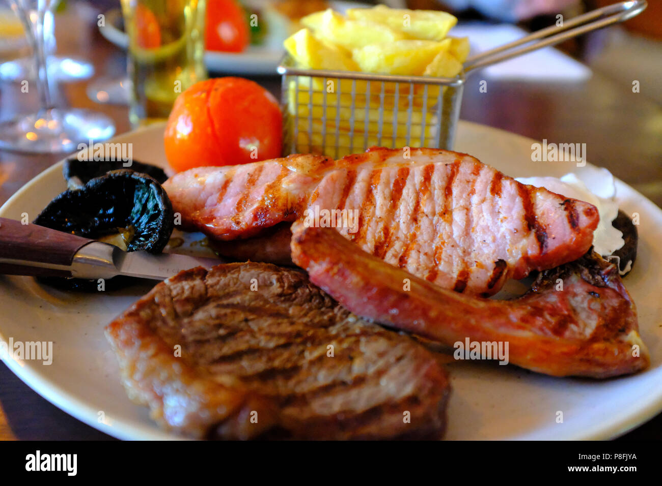 Mixed Grill cooked on a plate Stock Photo - Alamy