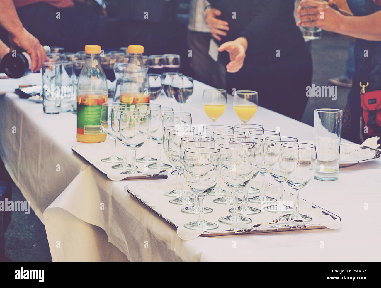 Table served with glasses for a buffet table Stock Photo - Alamy