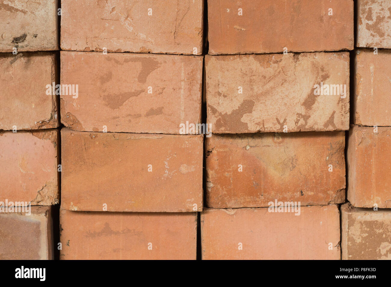 Background of folded red bricks Stock Photo - Alamy