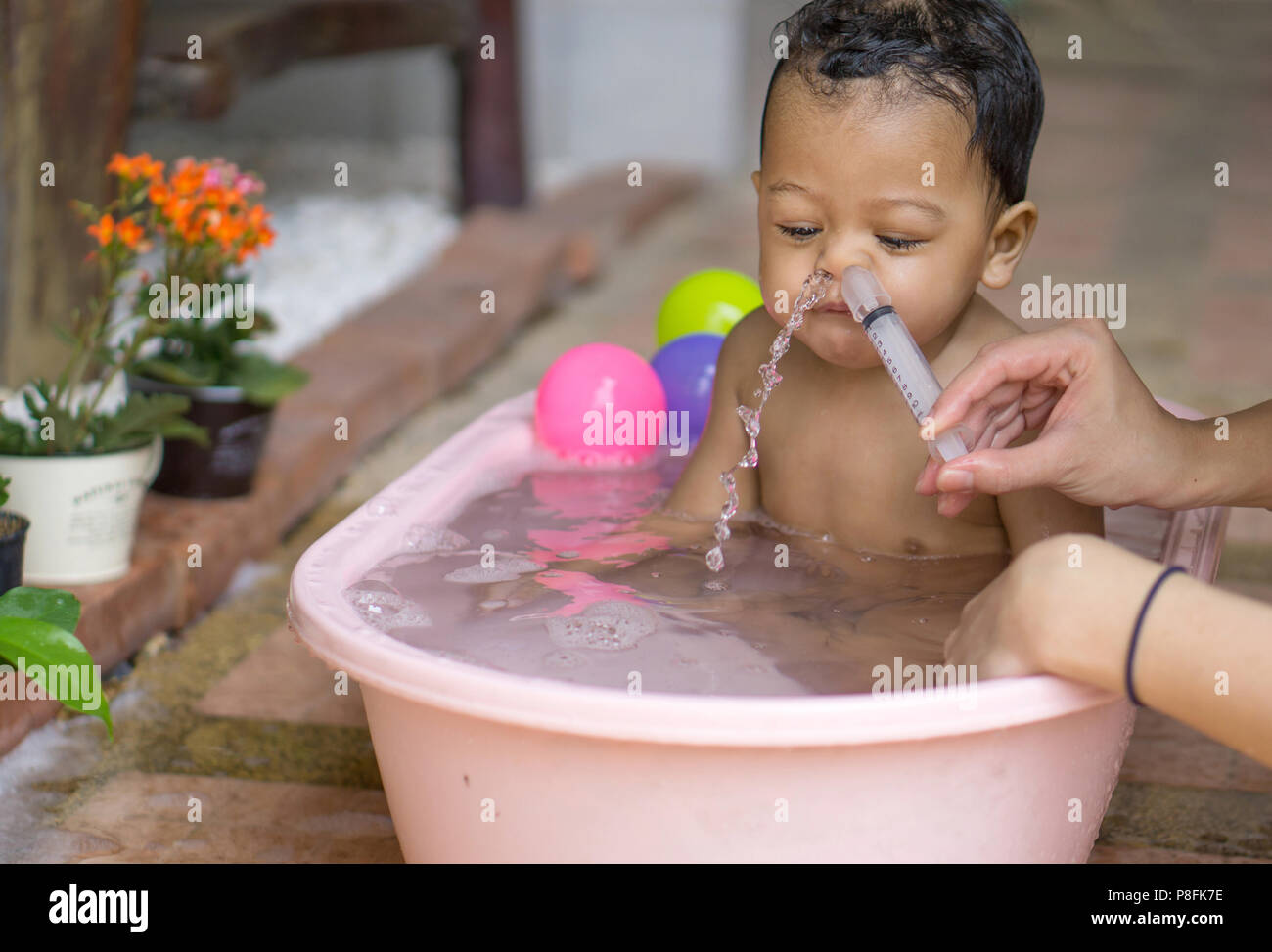 Saline spray child hi-res stock photography and images - Alamy