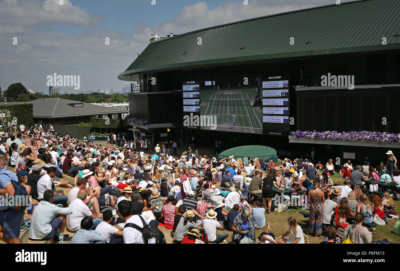 Spectators on Murray Mound watch the big screen on day nine of the ...