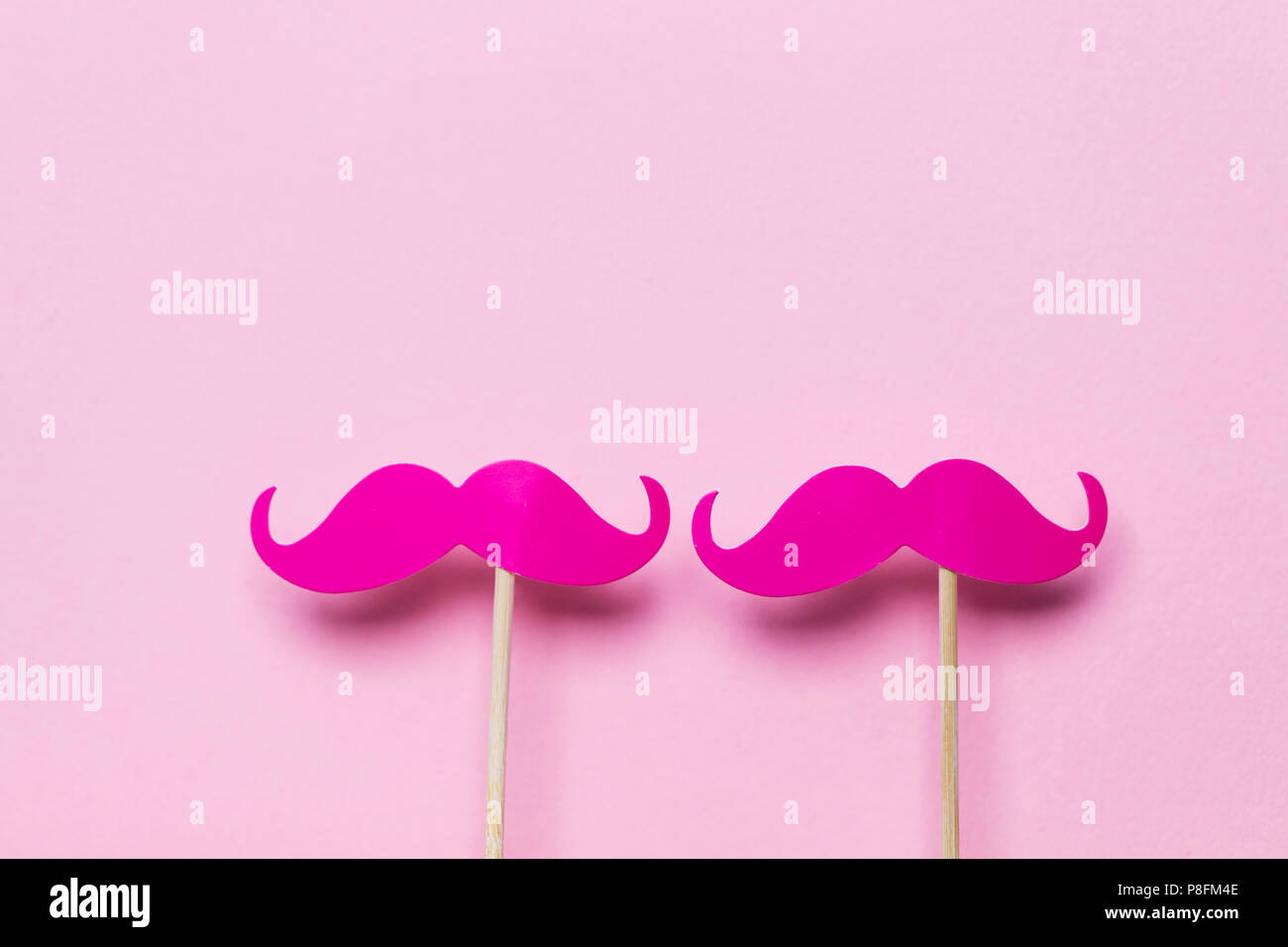 Pink moustache on a pink background. Modern masculinity concept Stock ...