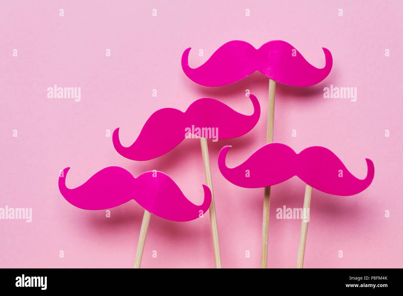 Pink moustache on a pink background. Modern masculinity concept Stock ...