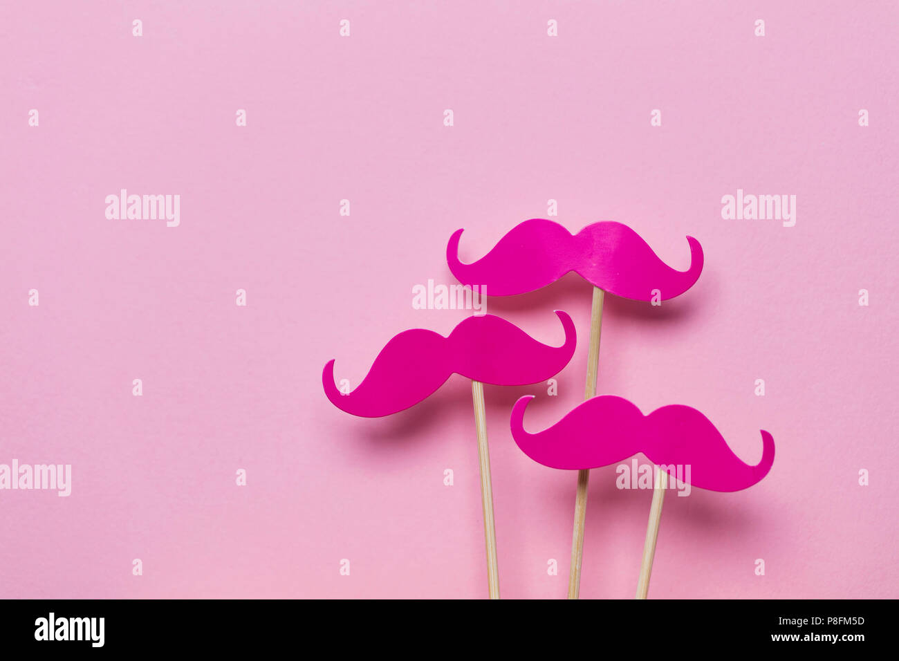 Pink moustache on a pink background. Modern masculinity concept Stock ...