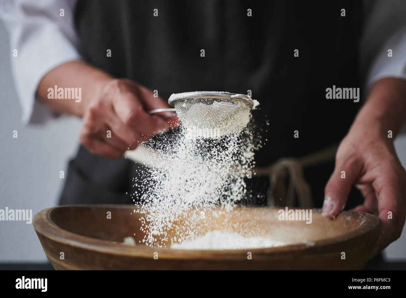 Woman sieve sifting flour hi-res stock photography and images - Alamy