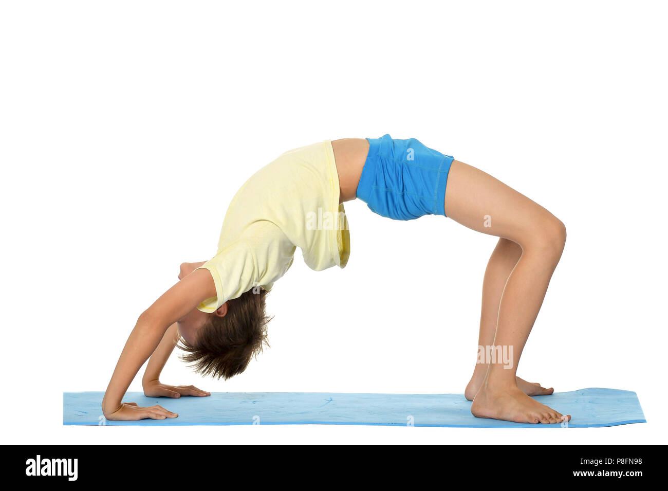 Young boy doing exercises Stock Photo - Alamy