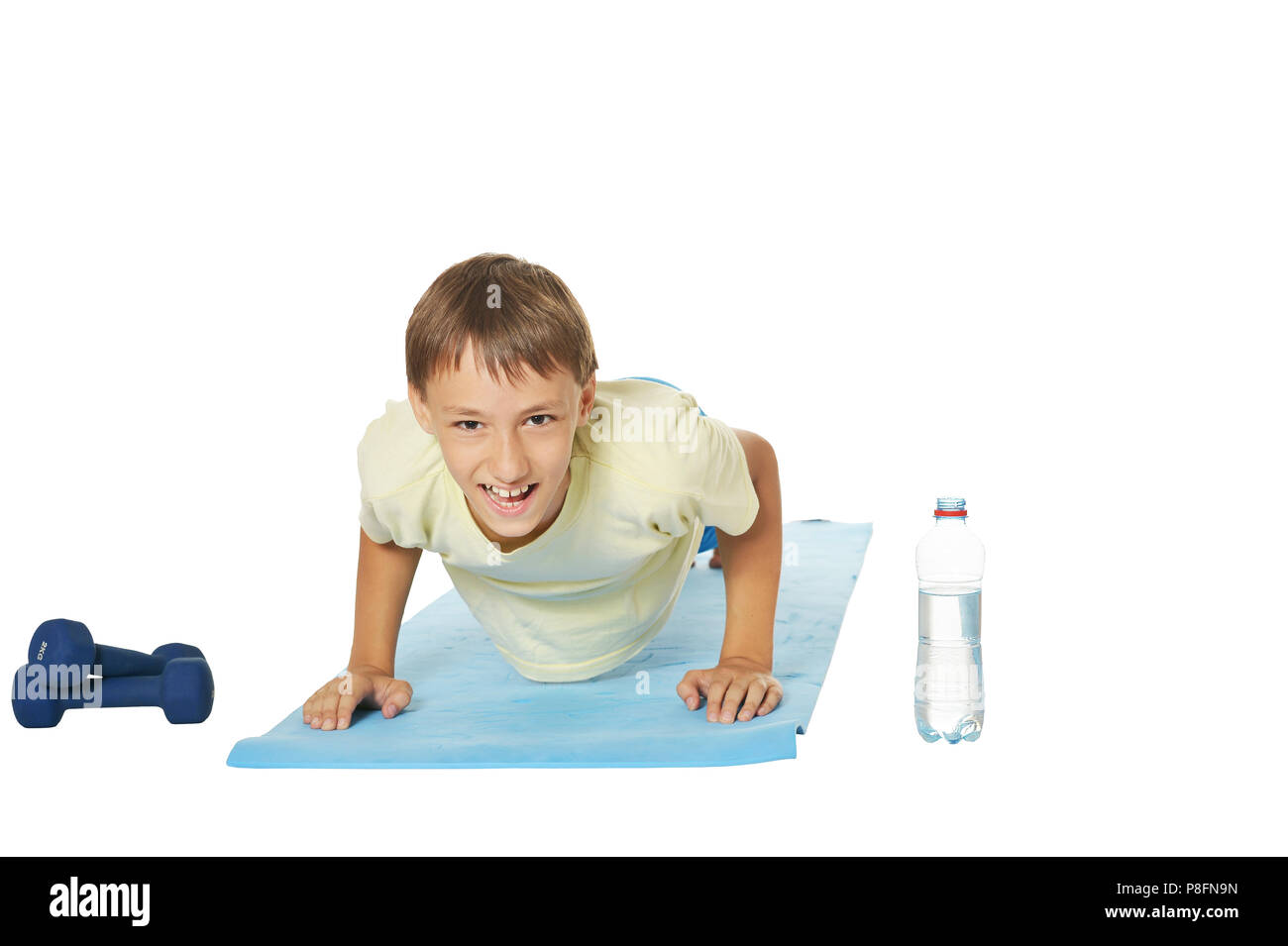 Young boy doing exercises Stock Photo - Alamy