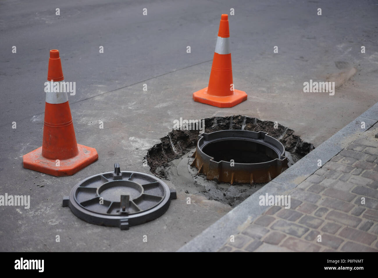 manhole cover replacement, sewer system repair, sewerage; roadworks ...