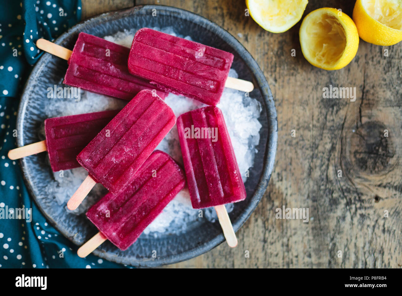 Red popsicles on ice Stock Photo - Alamy