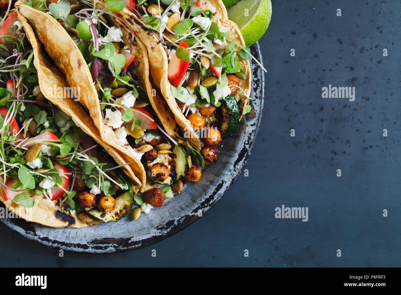 Vegetable tacos on blue background Stock Photo - Alamy