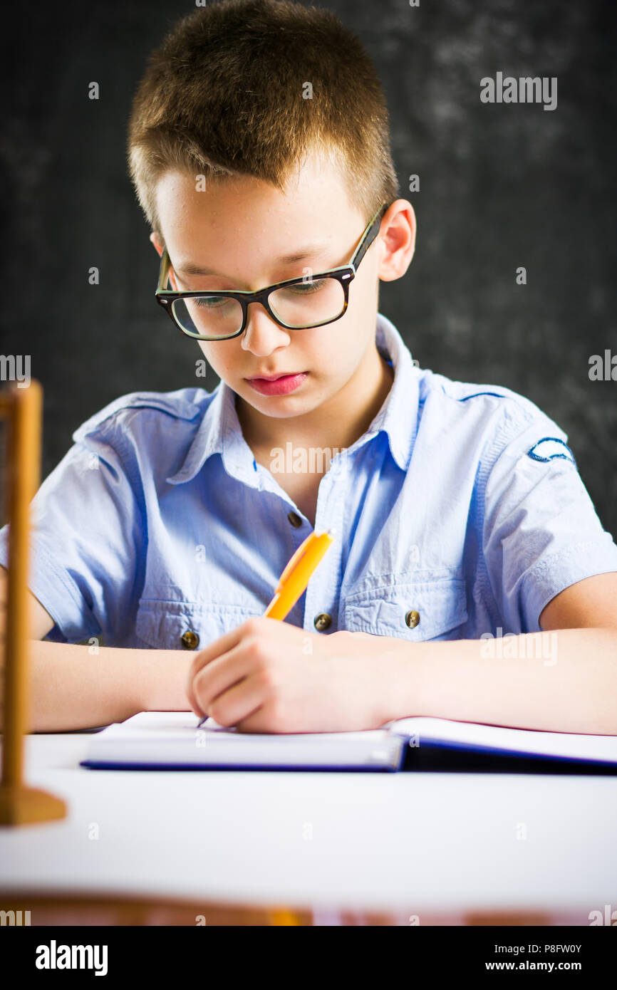 Teen boy writing desk home hi-res stock photography and images - Alamy