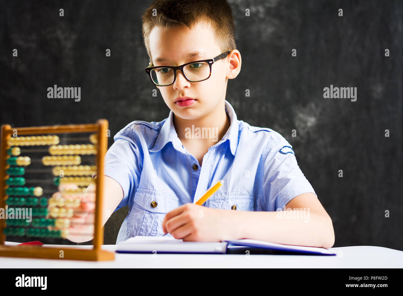 Child home alone homework hi-res stock photography and images - Alamy