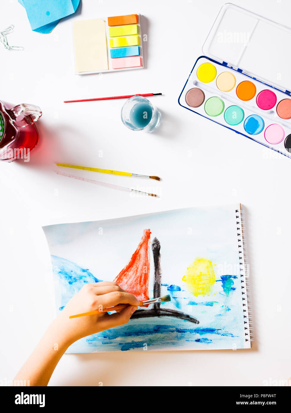 Boy making a painting of a boat first person view Stock Photo - Alamy