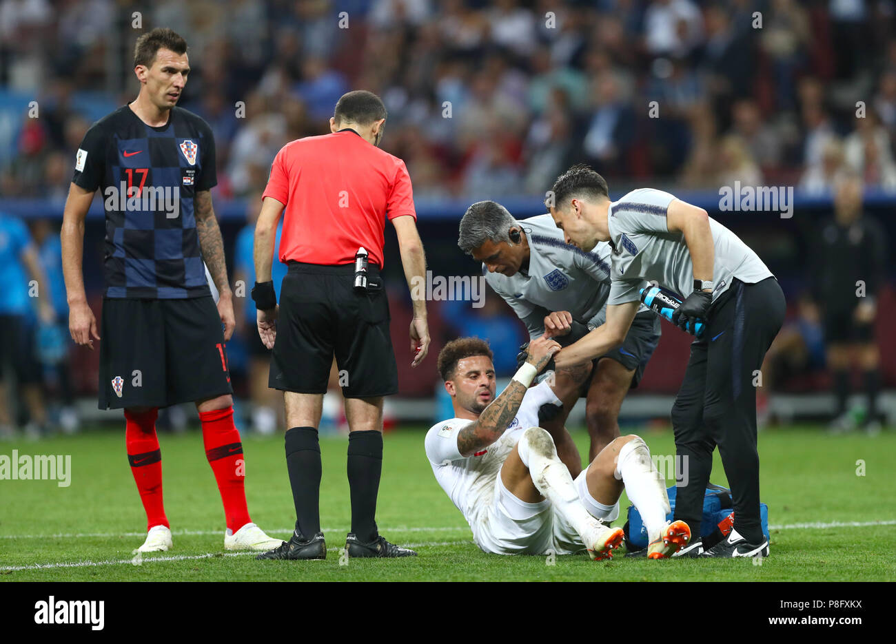 England's Kyle Walker receives medical attention during the FIFA World ...