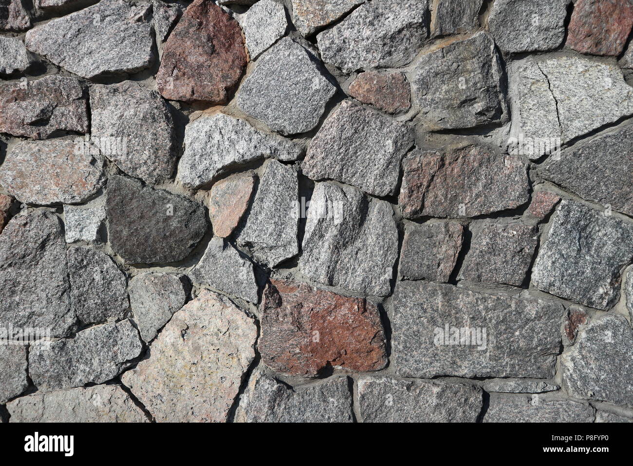 Rubble gray and brown stone wall, rubblework Stock Photo - Alamy