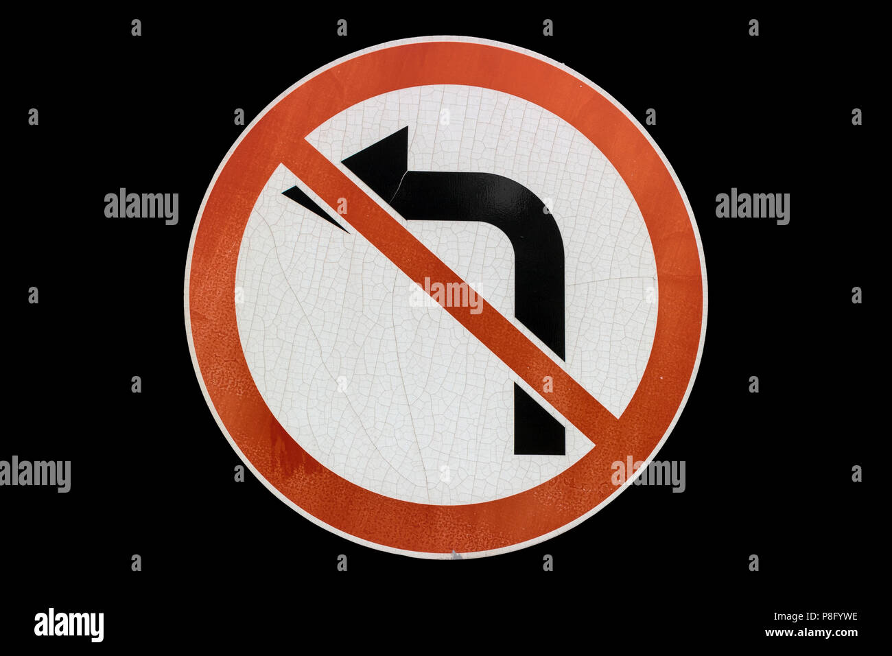 Old round road sing 'Left turn prohibited' isolated on black Stock ...