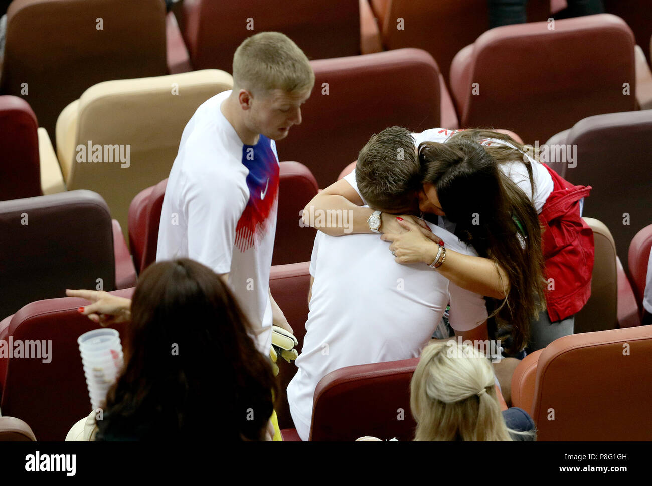 England's Jamie Vardy is hugged by his wife Rebekah Vardy after the ...