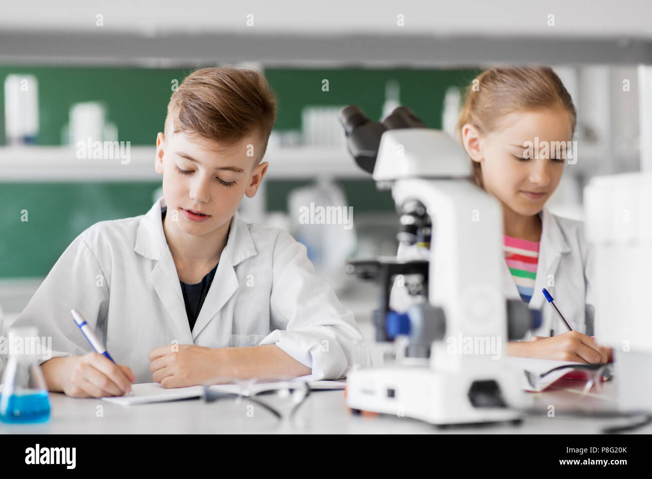kids studying chemistry at school laboratory Stock Photo - Alamy