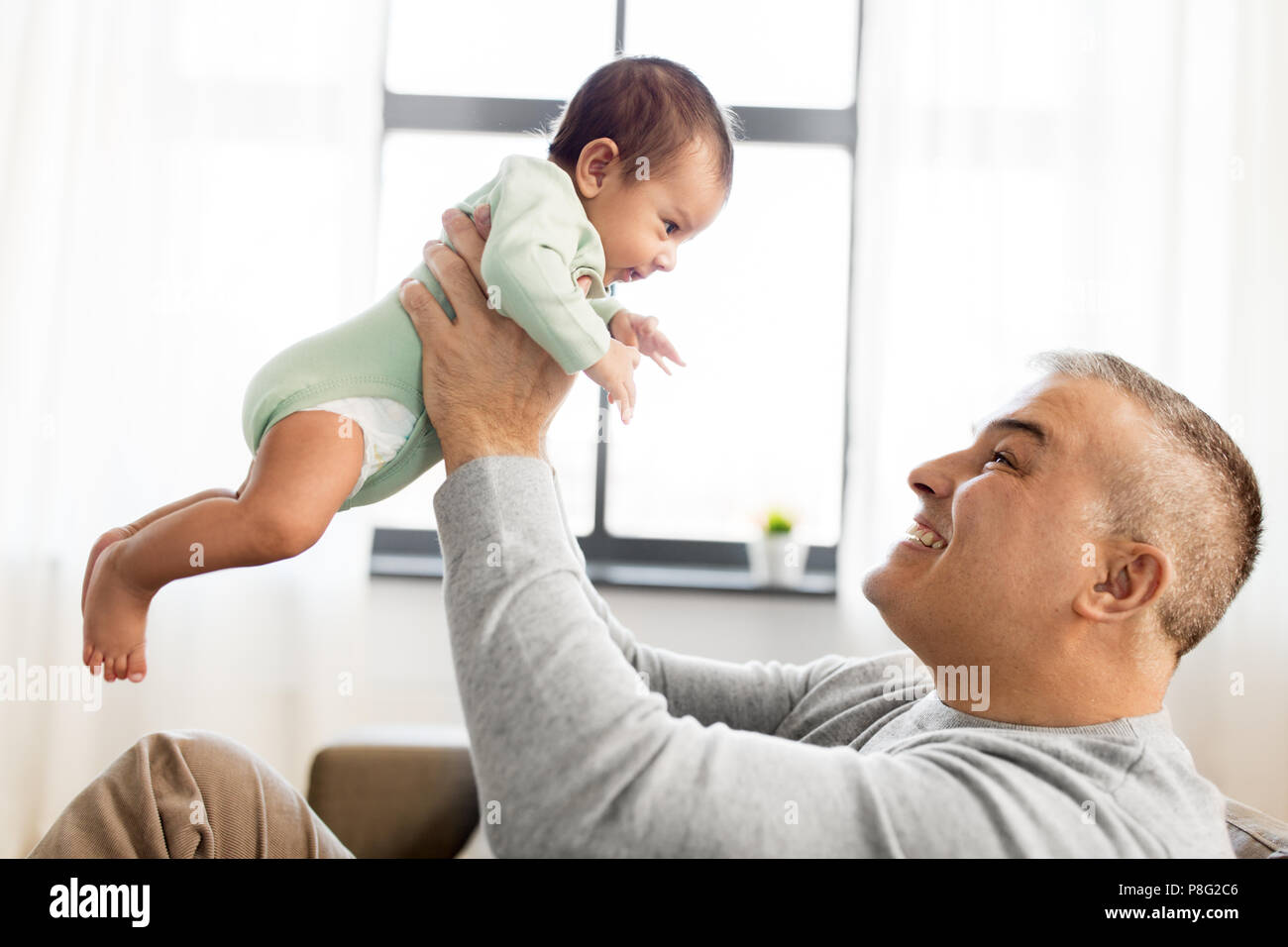 happy father with little baby boy at home Stock Photo - Alamy