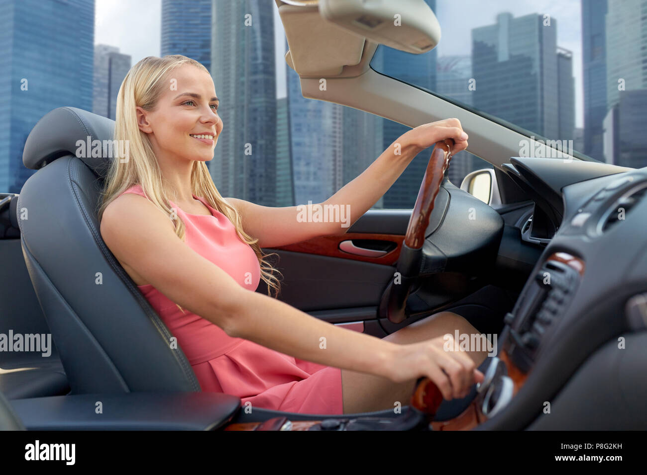 woman driving convertible car over singapore city Stock Photo - Alamy