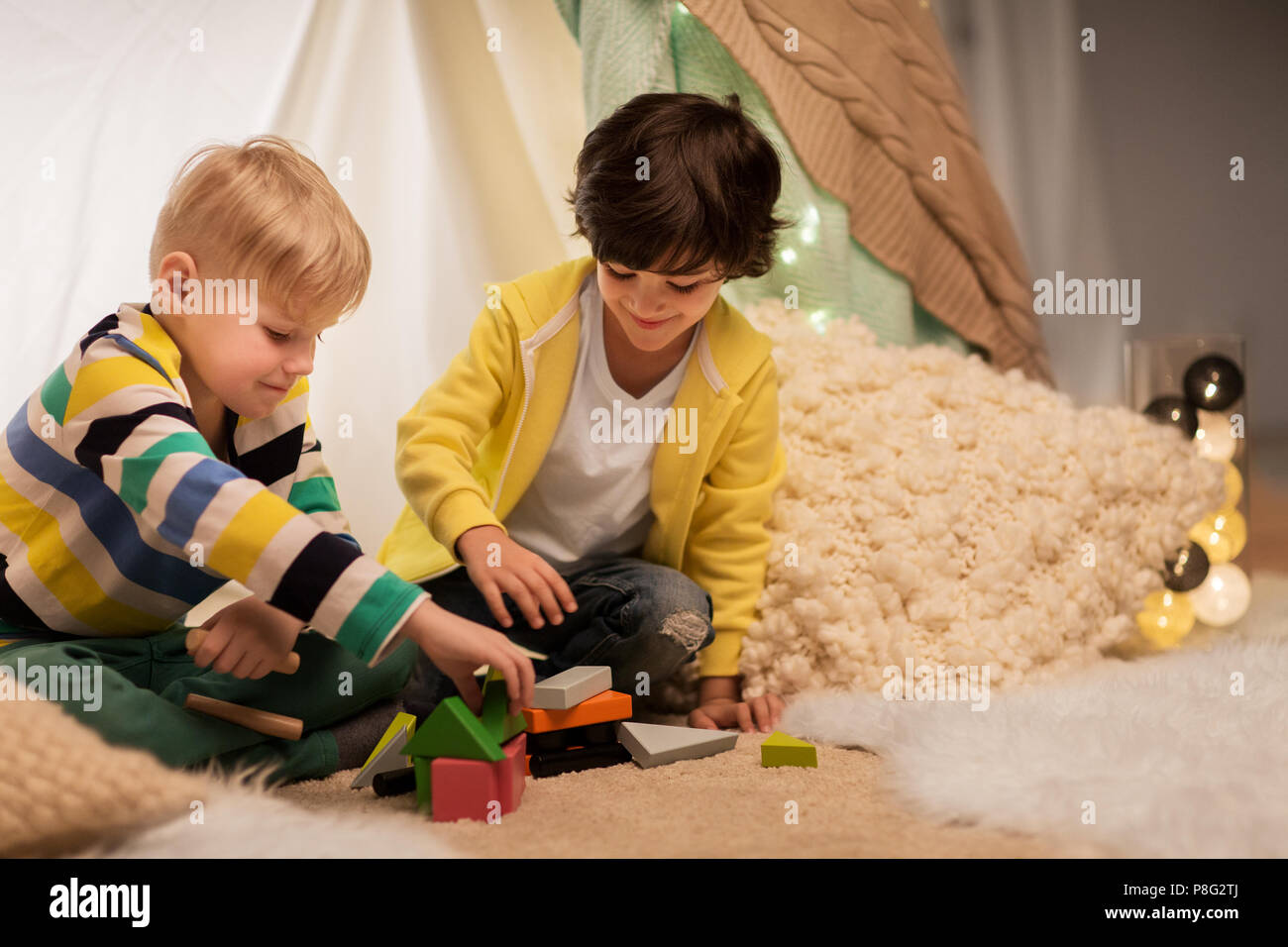 Adorable kids playing together blocks hi-res stock photography and ...