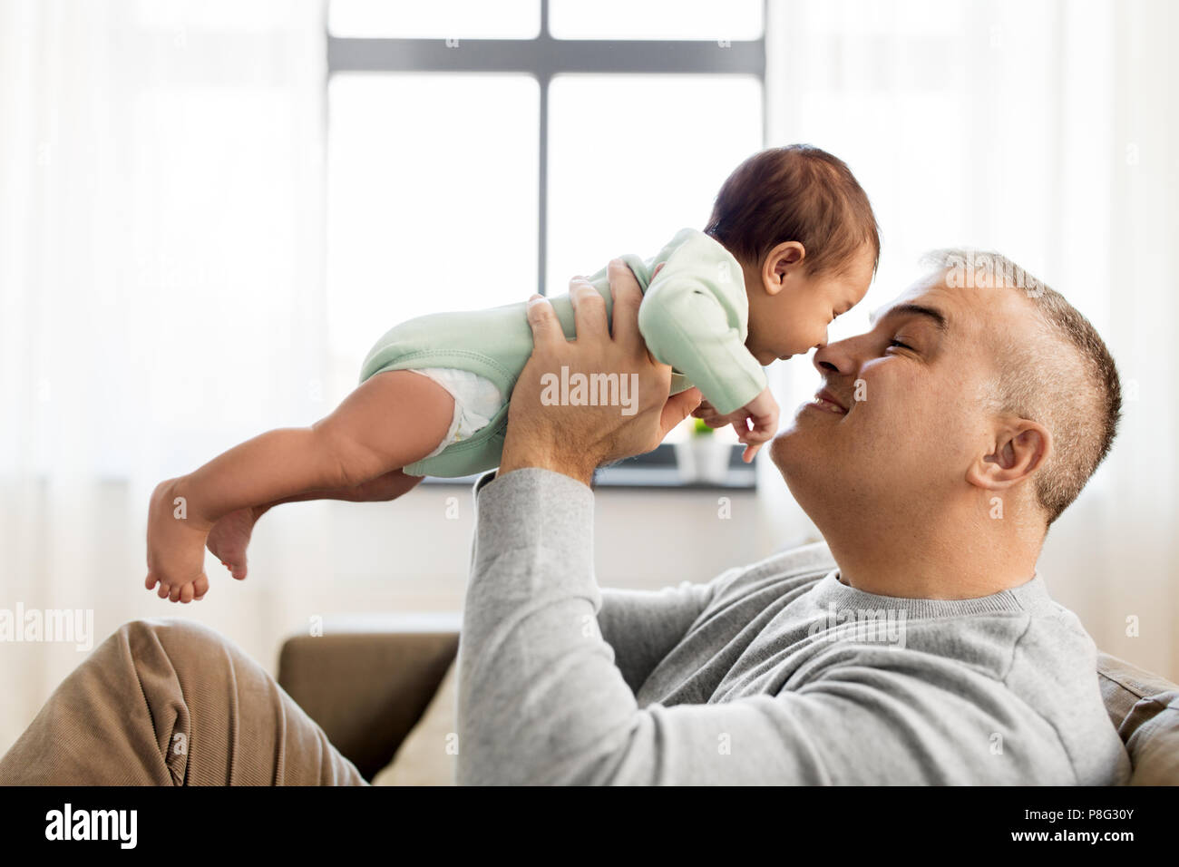 happy father with little baby boy at home Stock Photo - Alamy
