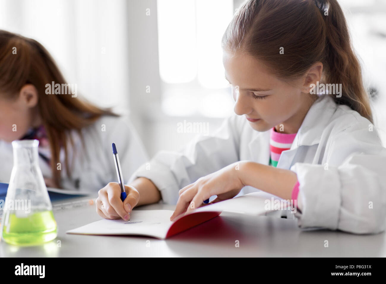 kids studying chemistry at school laboratory Stock Photo - Alamy