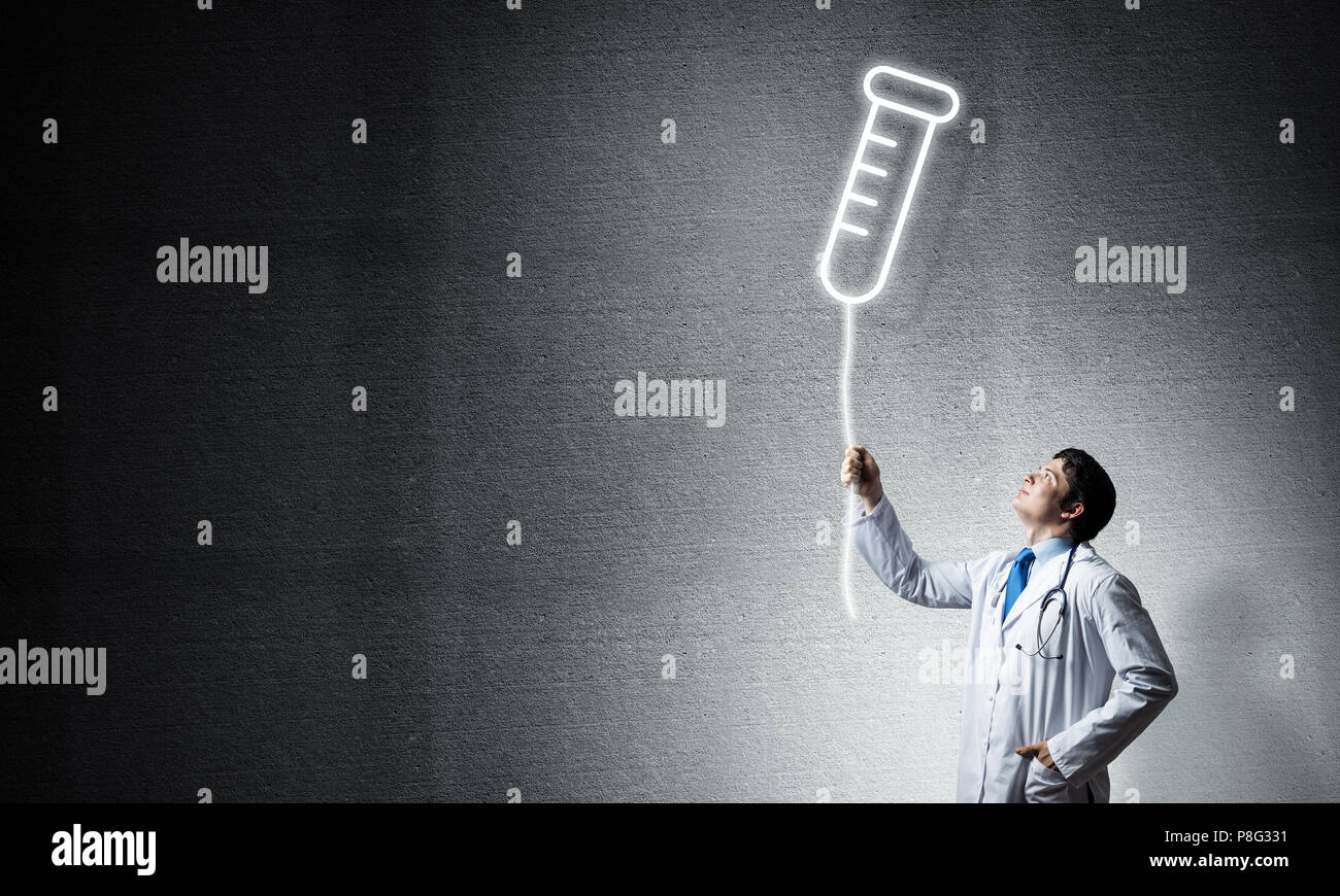 Doctor and vial symbol Stock Photo - Alamy