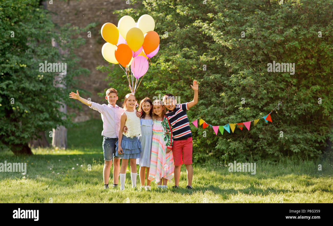 Happy Kids With Balloons At Summer Birthday Party Stock Photo Alamy happy-kids-with-balloons-at-summer-birthday-party-stock-photo-alamy