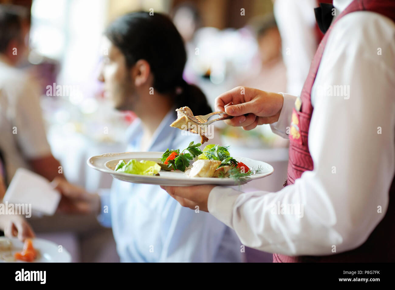 Waiter carrying plate meat dish hi-res stock photography and images - Alamy
