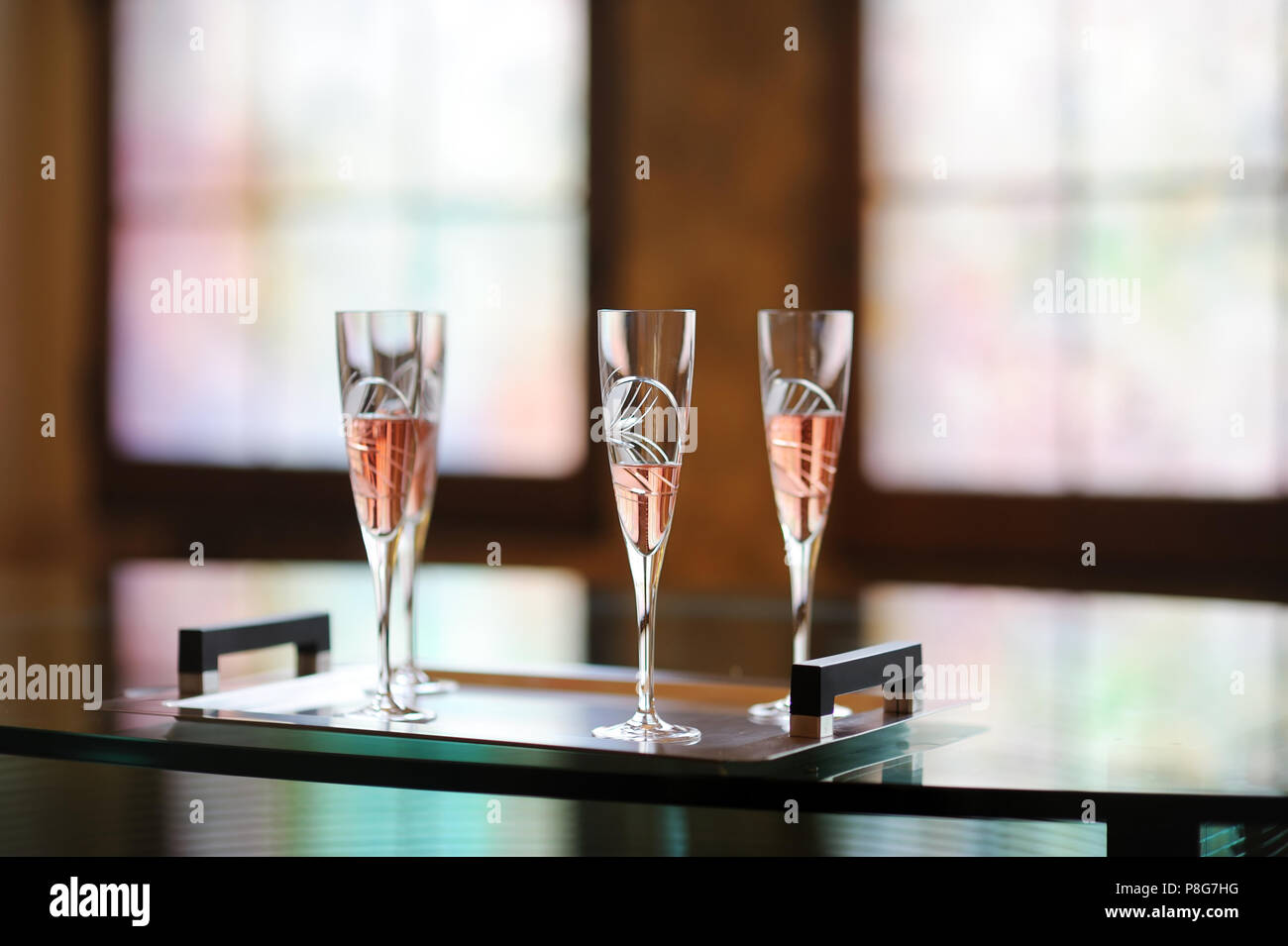 Three fancy glasses of red champagne Stock Photo - Alamy