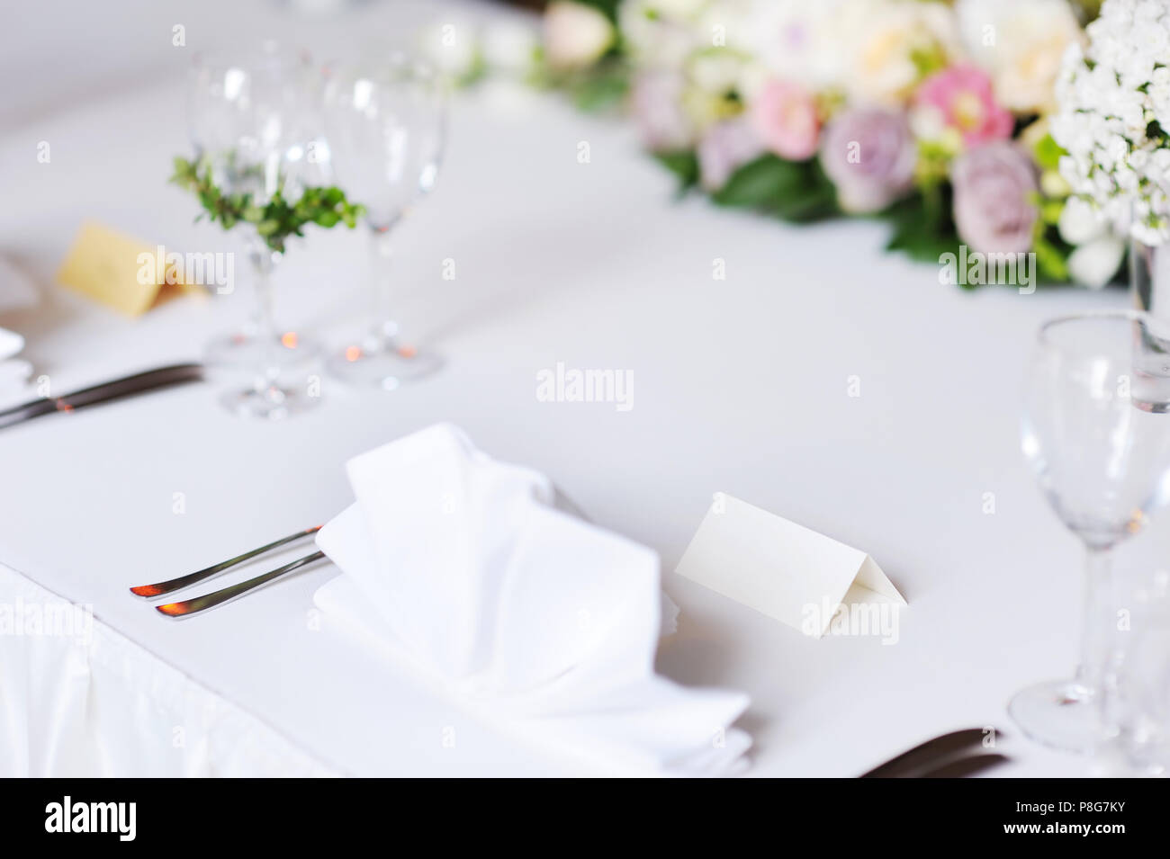 Empty place card on table set for a party Stock Photo - Alamy