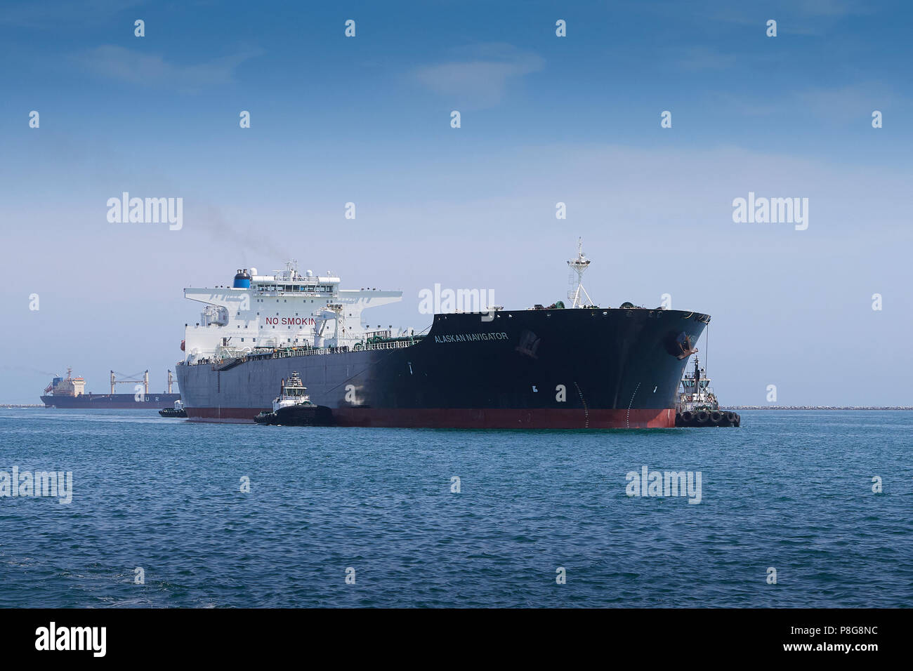 Supertanker with tugboats hi-res stock photography and images - Alamy