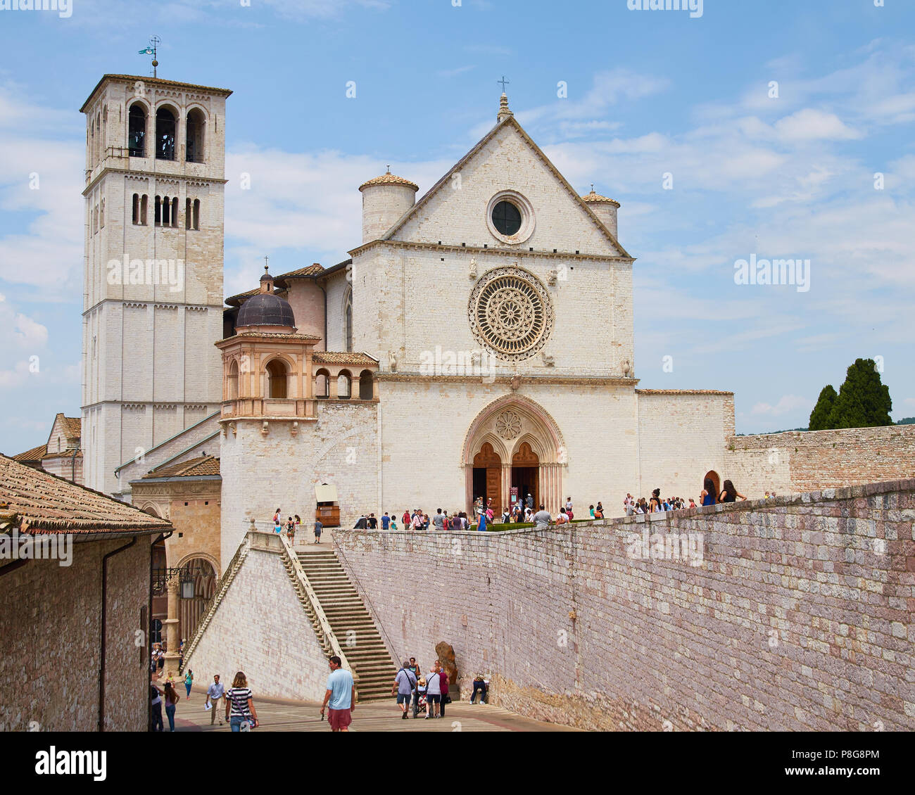 ASSISI, ITALY-JULY 9, 2013: Visitors and pilgrims line the walls ...