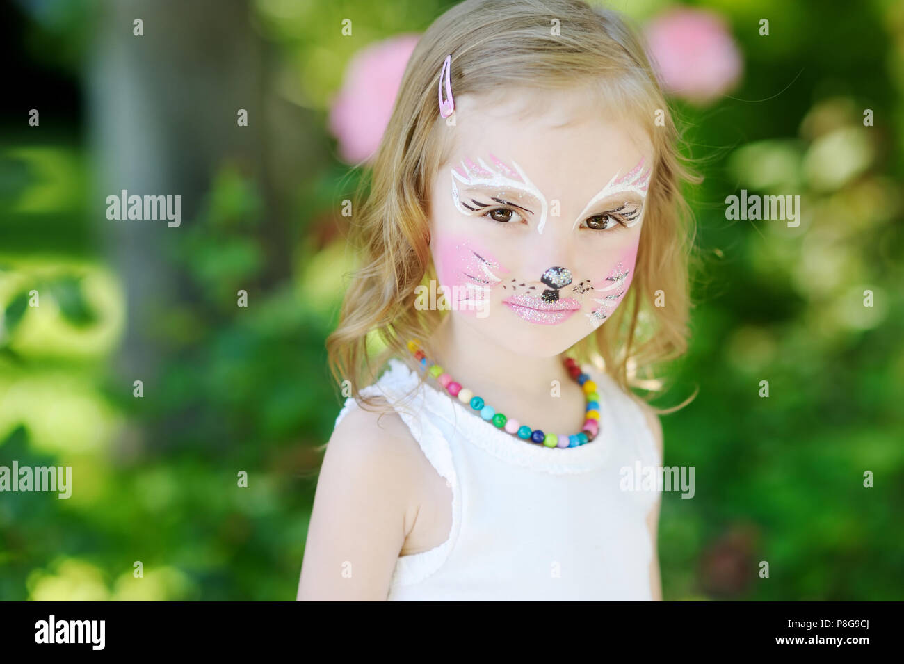 Adorable little girl with kitty painted face Stock Photo - Alamy