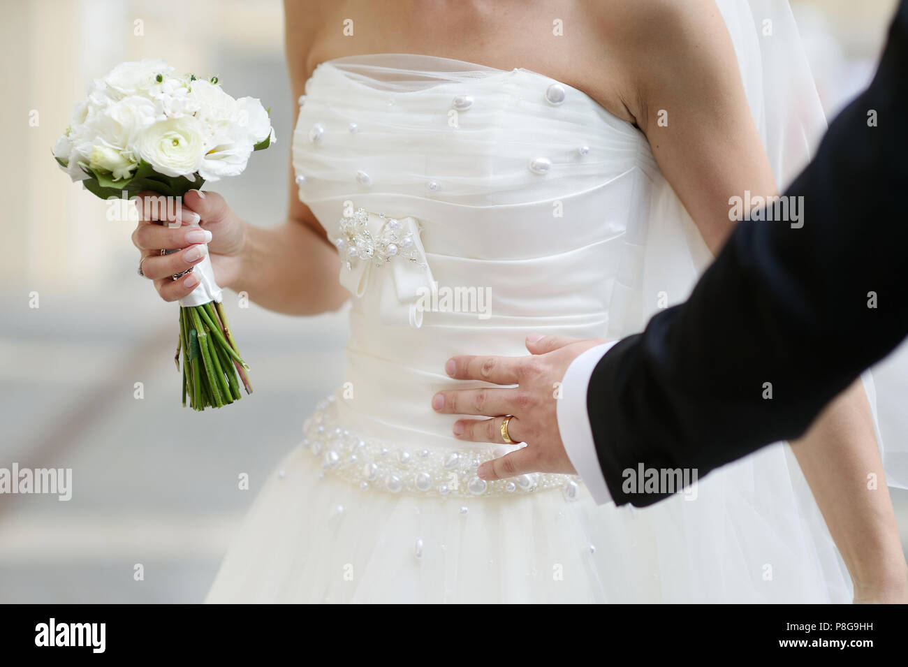 Bride is holding a wedding bouquet Stock Photo - Alamy
