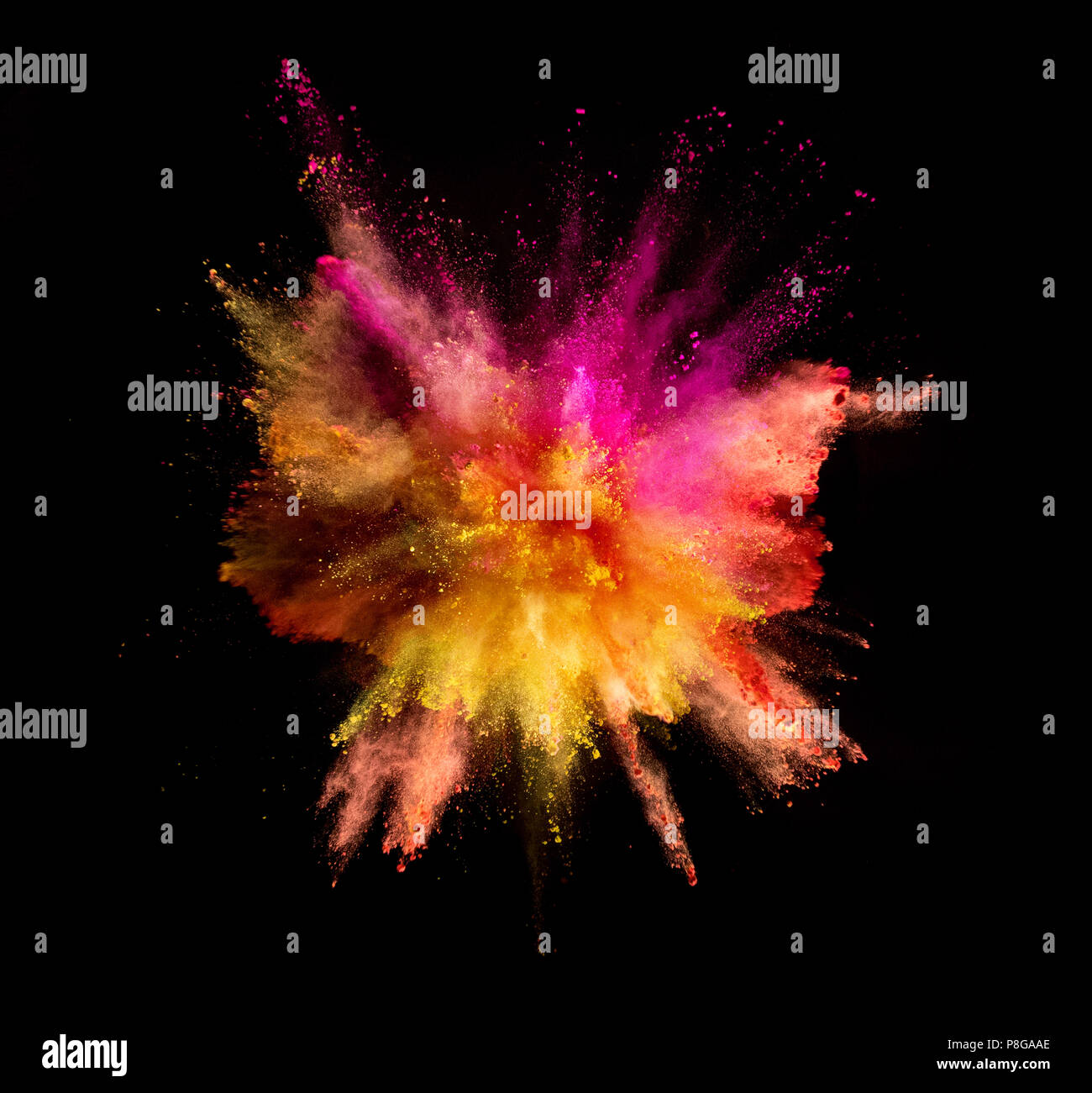 Explosion of coloured powder isolated on black background Stock Photo ...