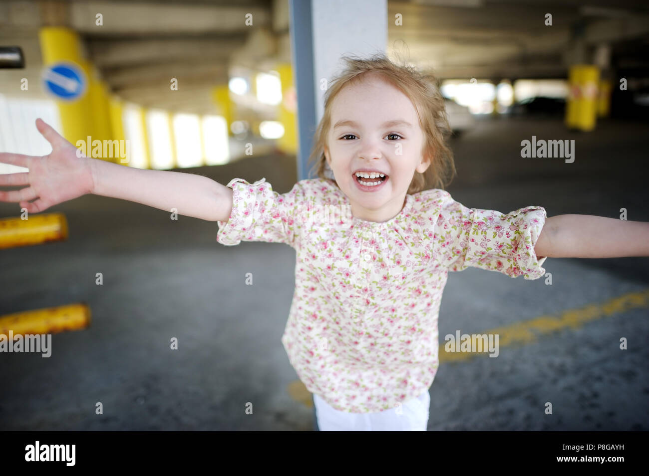 Adorable little girl expressive portrait outdoors Stock Photo - Alamy