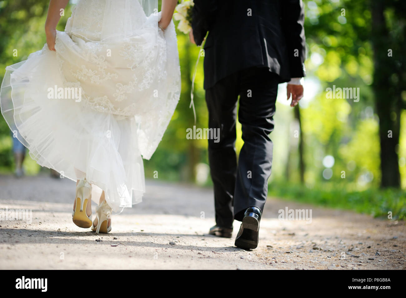 Married wedding couple walking away hi-res stock photography and images ...